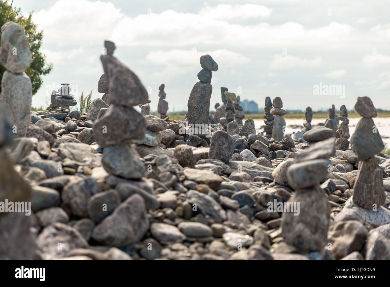 stone pyramids or towers on beach Stock Photo - Alamy