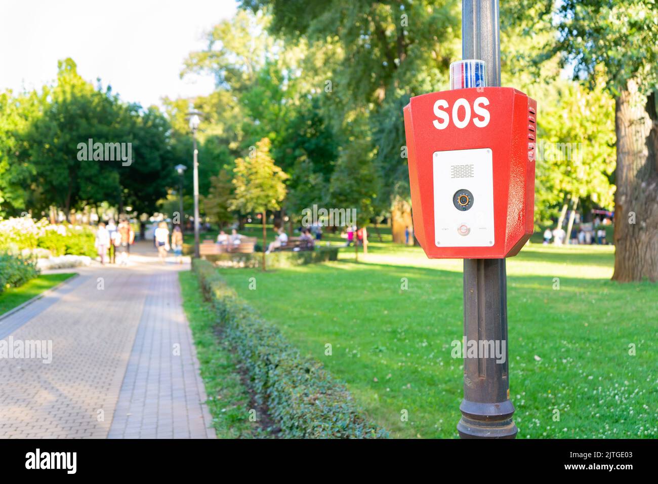 SOS, police, emergency button in the public park. Red box with video ...