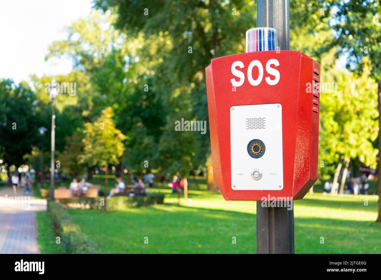 SOS, police, emergency button in the public park. Red box with video ...