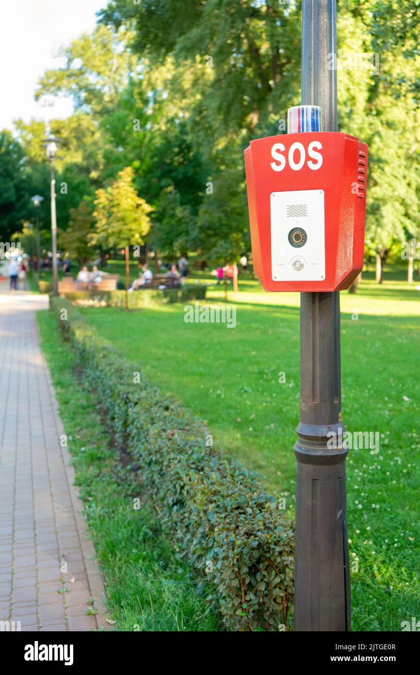 SOS, police, emergency button in the public park. Red box with video ...