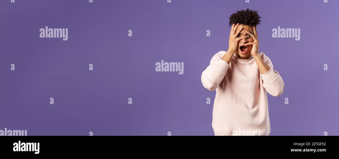 Portrait of shocked, startled handsome man being embarrassed and scared ...