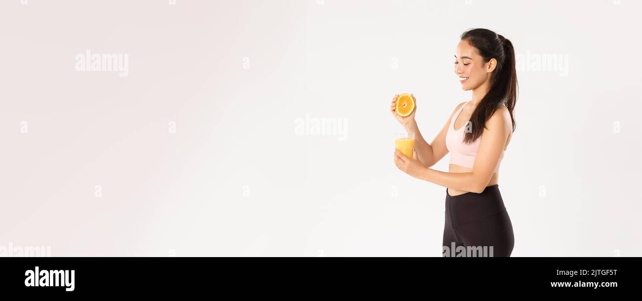 Sport, wellbeing and active lifestyle concept. Portrait of smiling healthy and slim asian girl ...