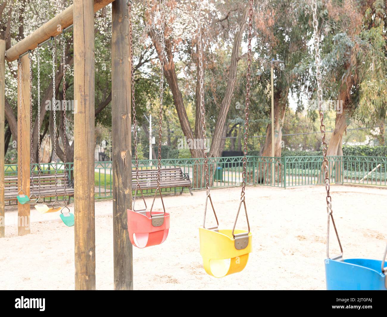 Swings at a park hi-res stock photography and images - Alamy