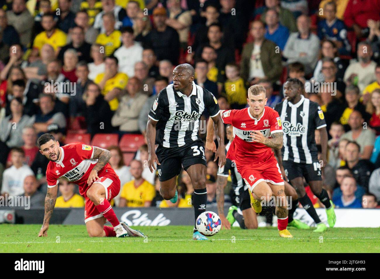 Edo Kayembe #39 of Watford battle for the ball Alex Mowatt #4 of ...