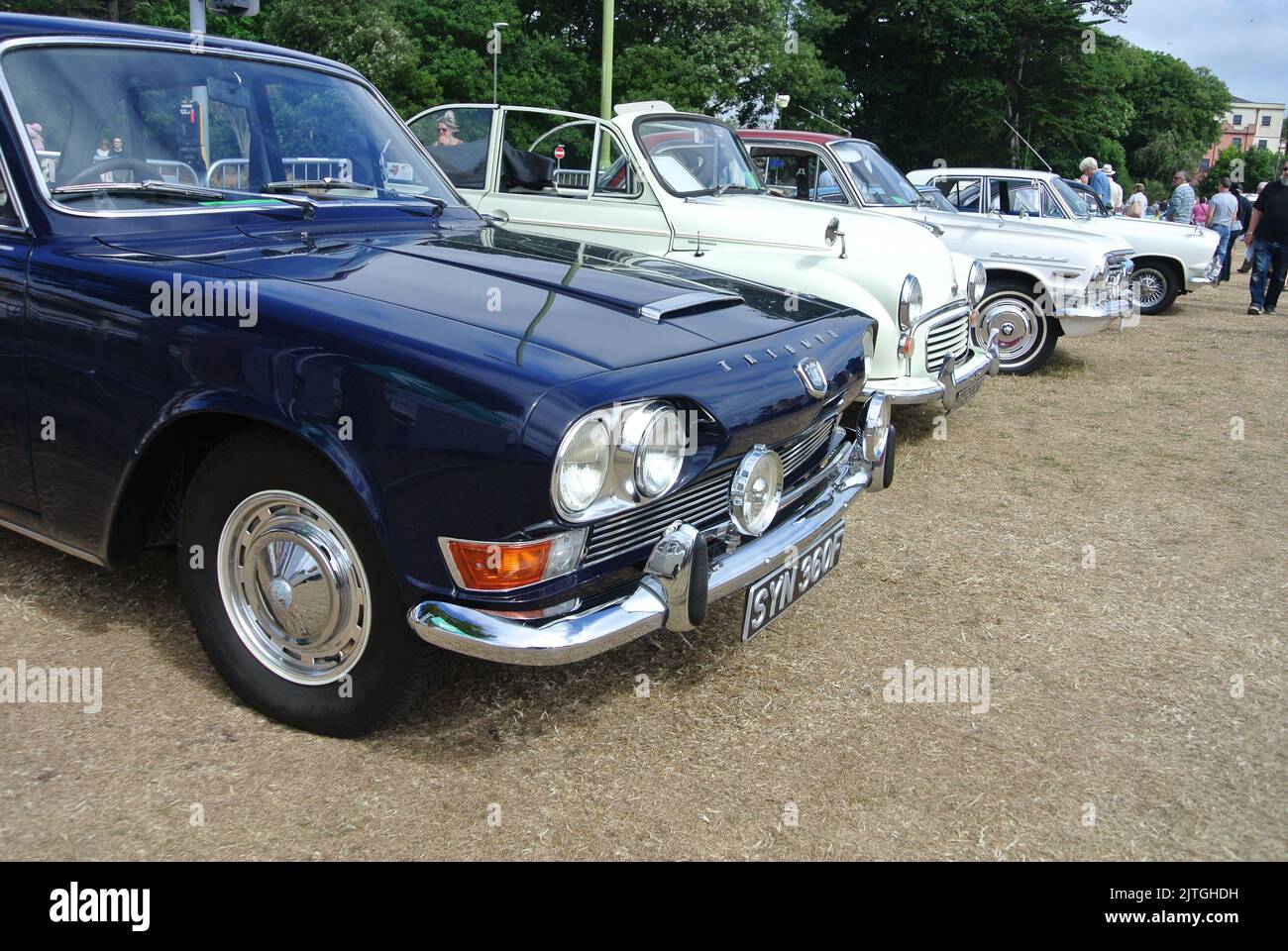 A line of classic cars parked on display at the English Riviera classic ...