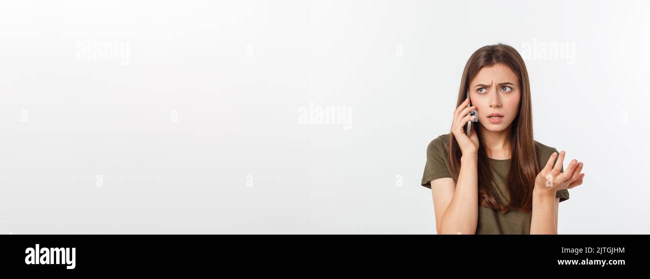 Worried young woman looks nervously, Female is nervous while talking on ...