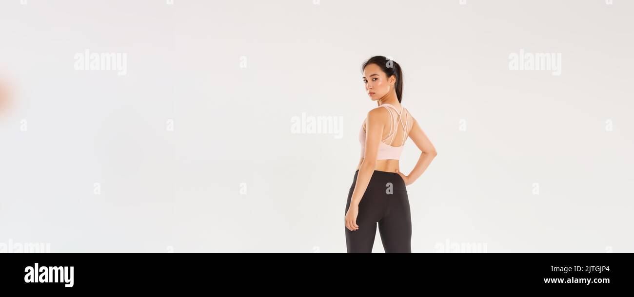 Full length of focused and motivated young asian girl with slim perfect ...