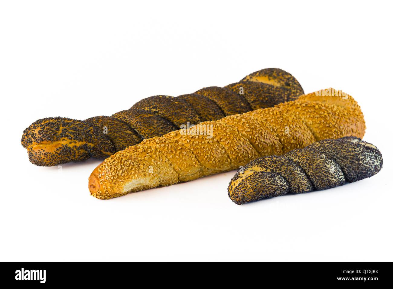 Isolated studio shot of three sizes of braided bred sticks - two with ...