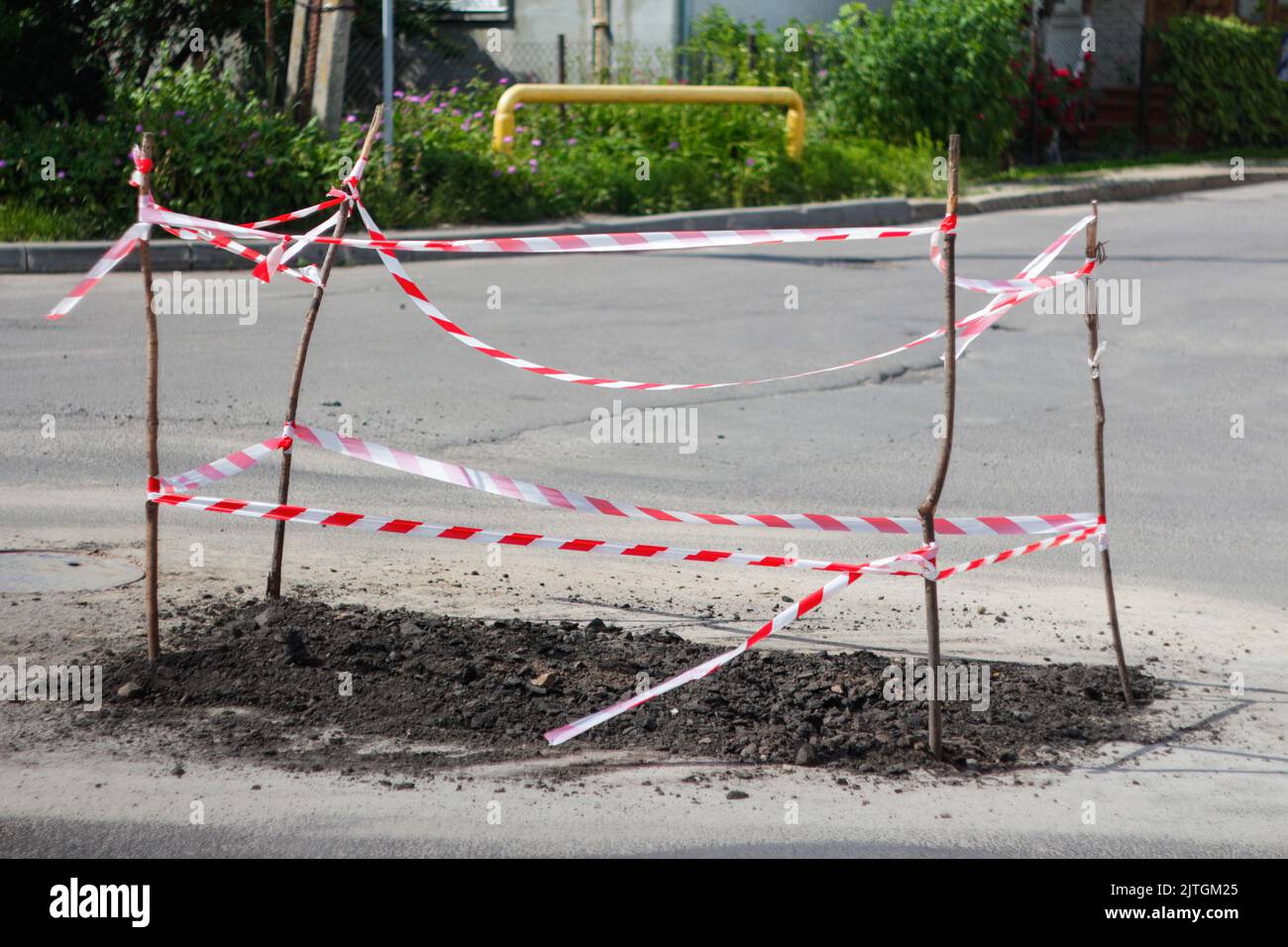 Defocus repair road. Red and white barrier tape protect. Road repair ...