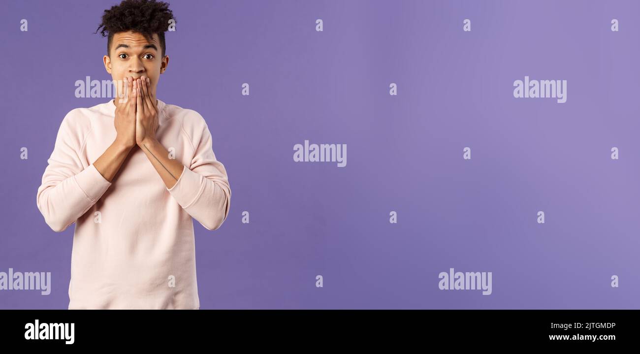 Portrait of shocked, impressed young hispanic hipster guy being ...