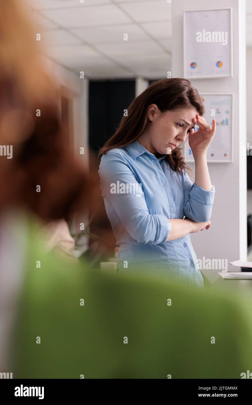 Depressed employee having professional burnout, suffering from headache ...