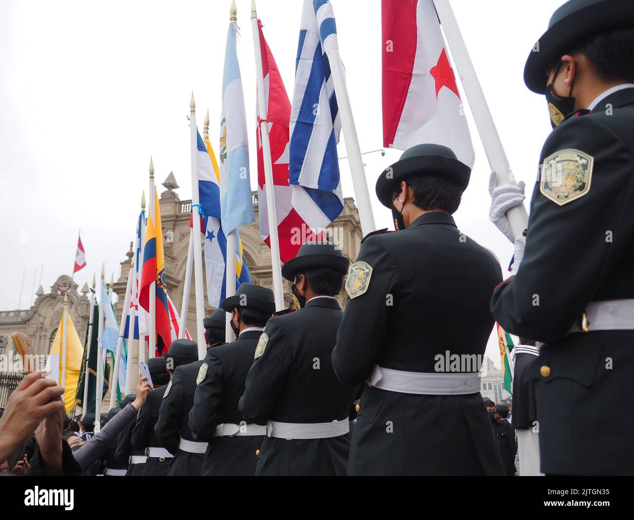Lima, 30/08/2022, Police women with American flags escorting devotees ...