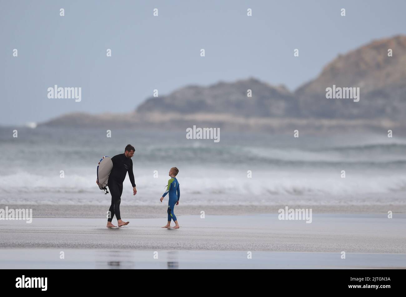 Father and son on beach surfing Surfers Surfing Stock Photo - Alamy