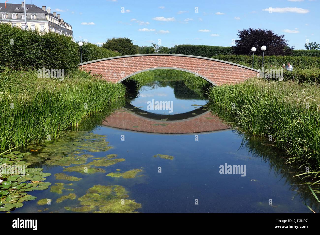 Ditch with arch bridge at the castle garden of Castle Augustusburg ...