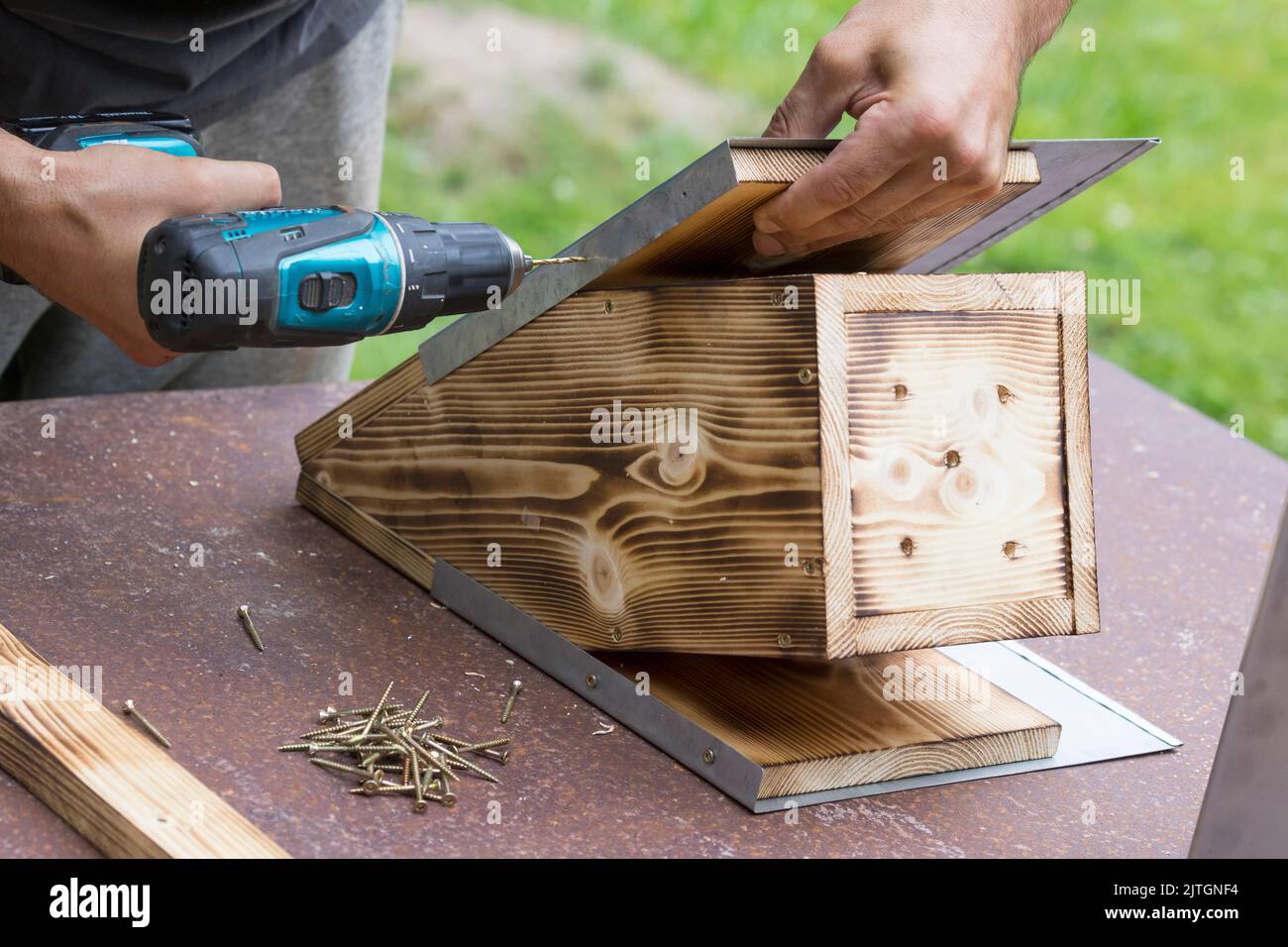 nest box series, step 11/13: a plate of zinc sheet protruding at the ...