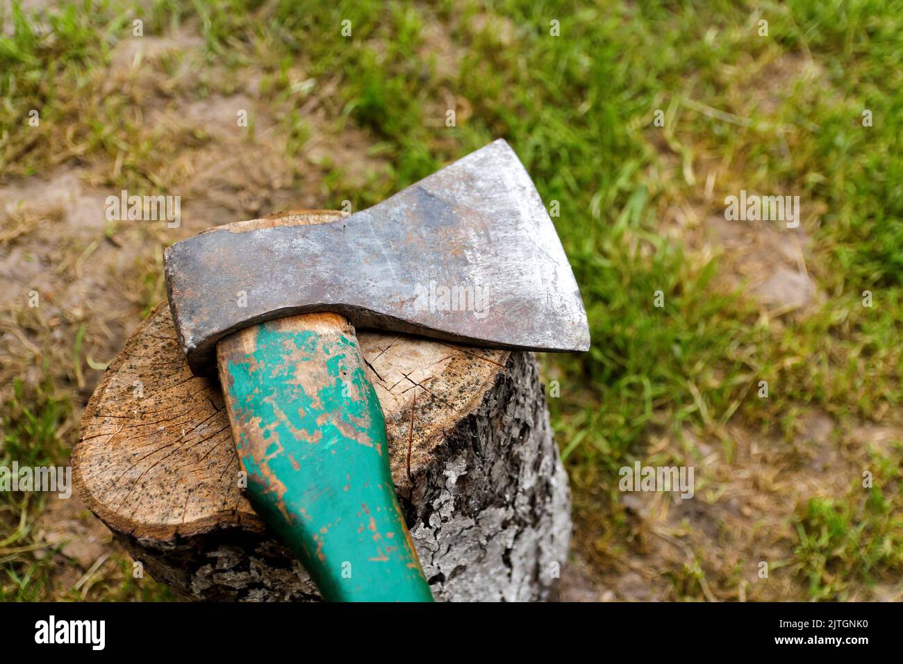 Defocus steel ax closeup. Big steel axe with wooden handle, metal ax ...