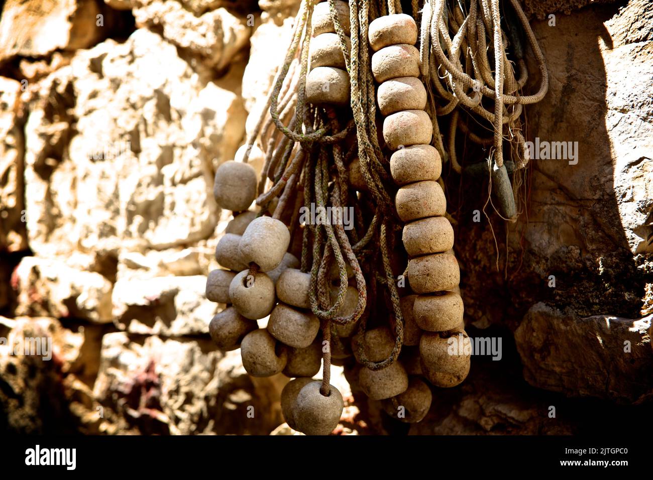 A selective focus shot of ropes with cork beads Stock Photo - Alamy