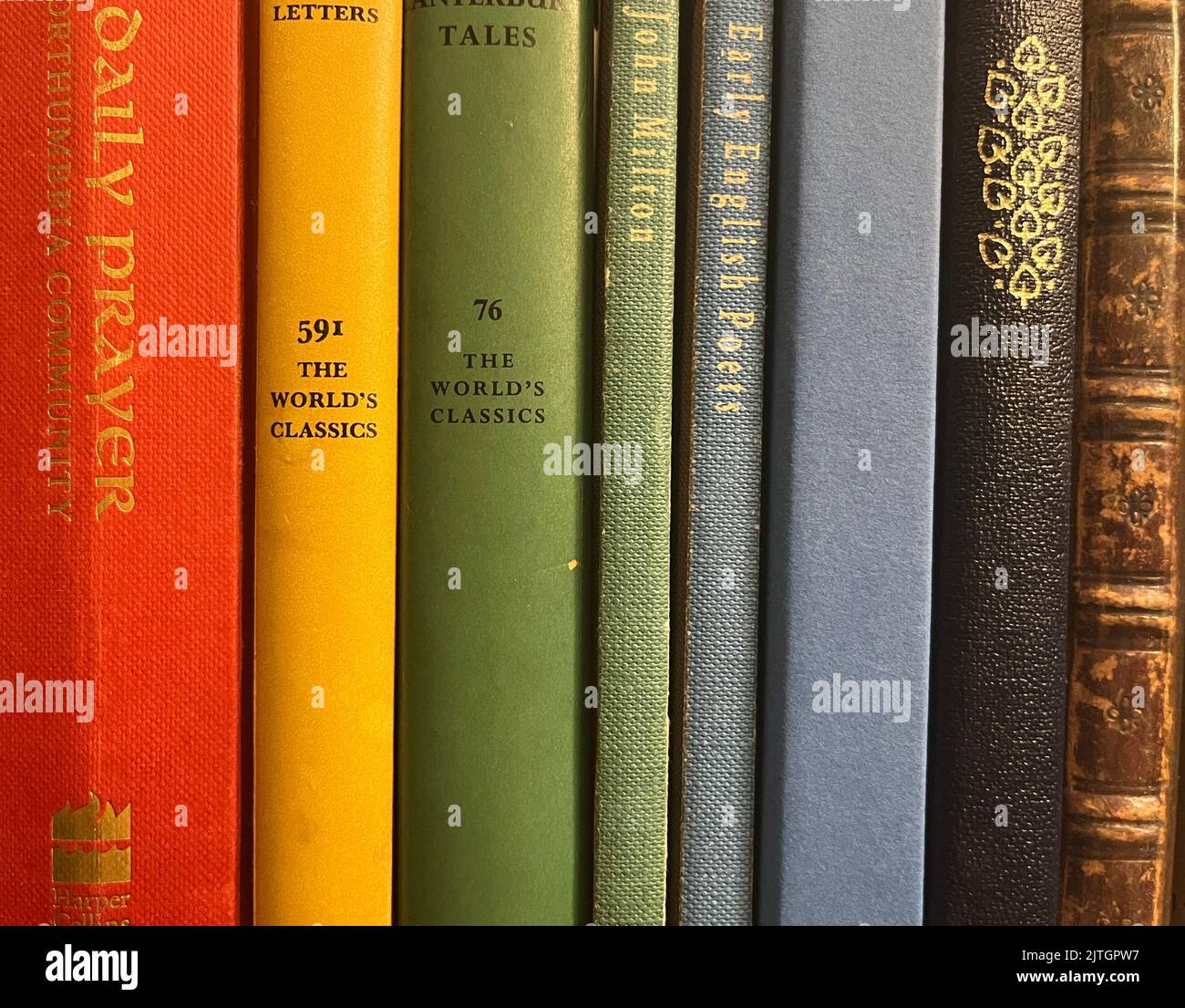 a row of rainbow-coloured old books Stock Photo - Alamy