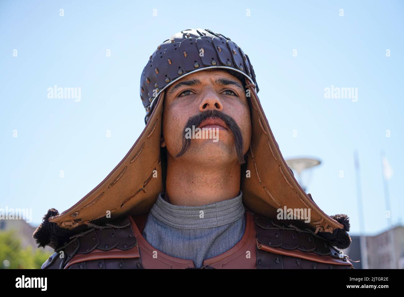 A soldier dressed in old war clothes representing the former Turkish ...