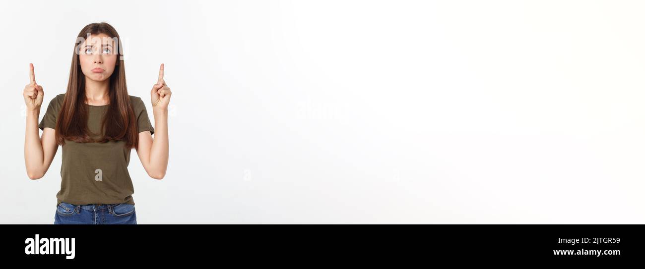 Beautiful young elegant woman over isolated background pointing hand ...