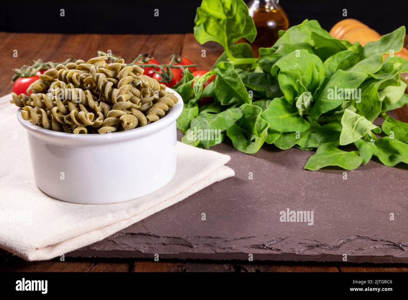 Raw spinach screw noodles, vegetarian, vegan . Healthy food Stock Photo ...