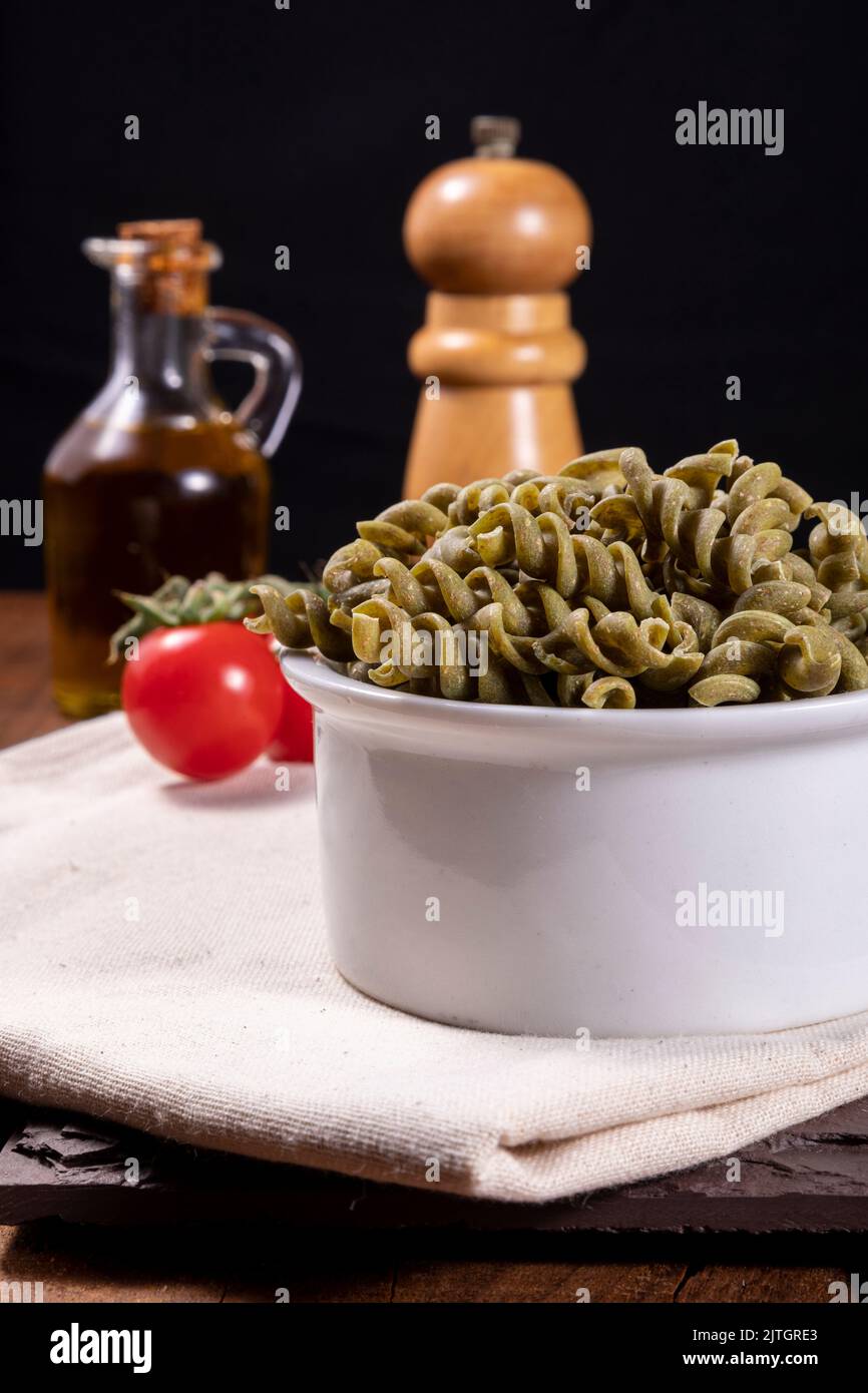 Raw spinach screw noodles, vegetarian, vegan . Healthy food Stock Photo ...