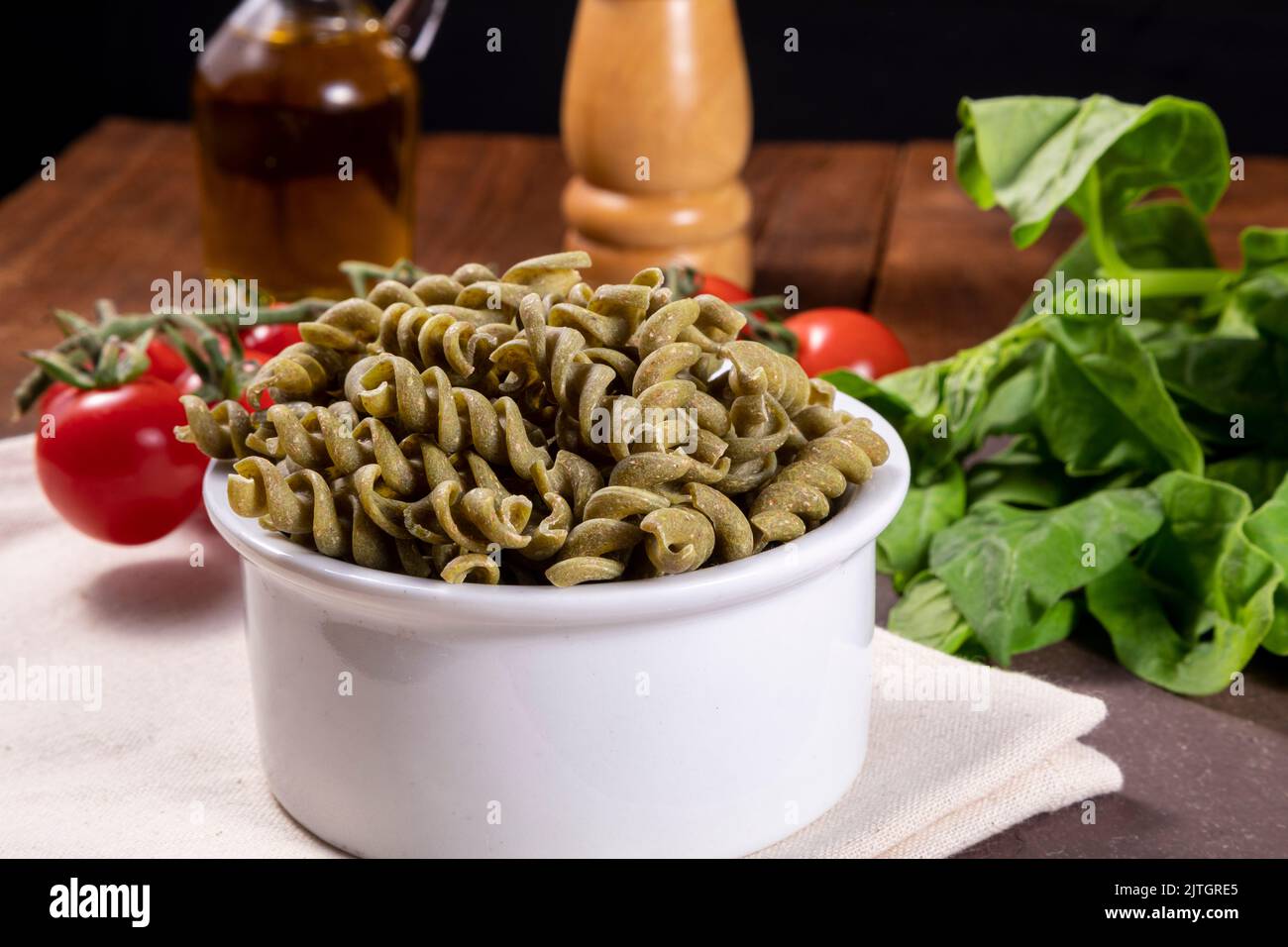 Raw spinach screw noodles, vegetarian, vegan . Healthy food Stock Photo ...