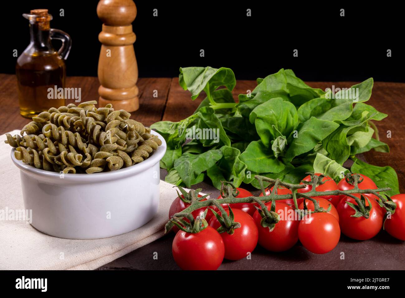 Raw spinach screw noodles, vegetarian, vegan . Healthy food Stock Photo ...