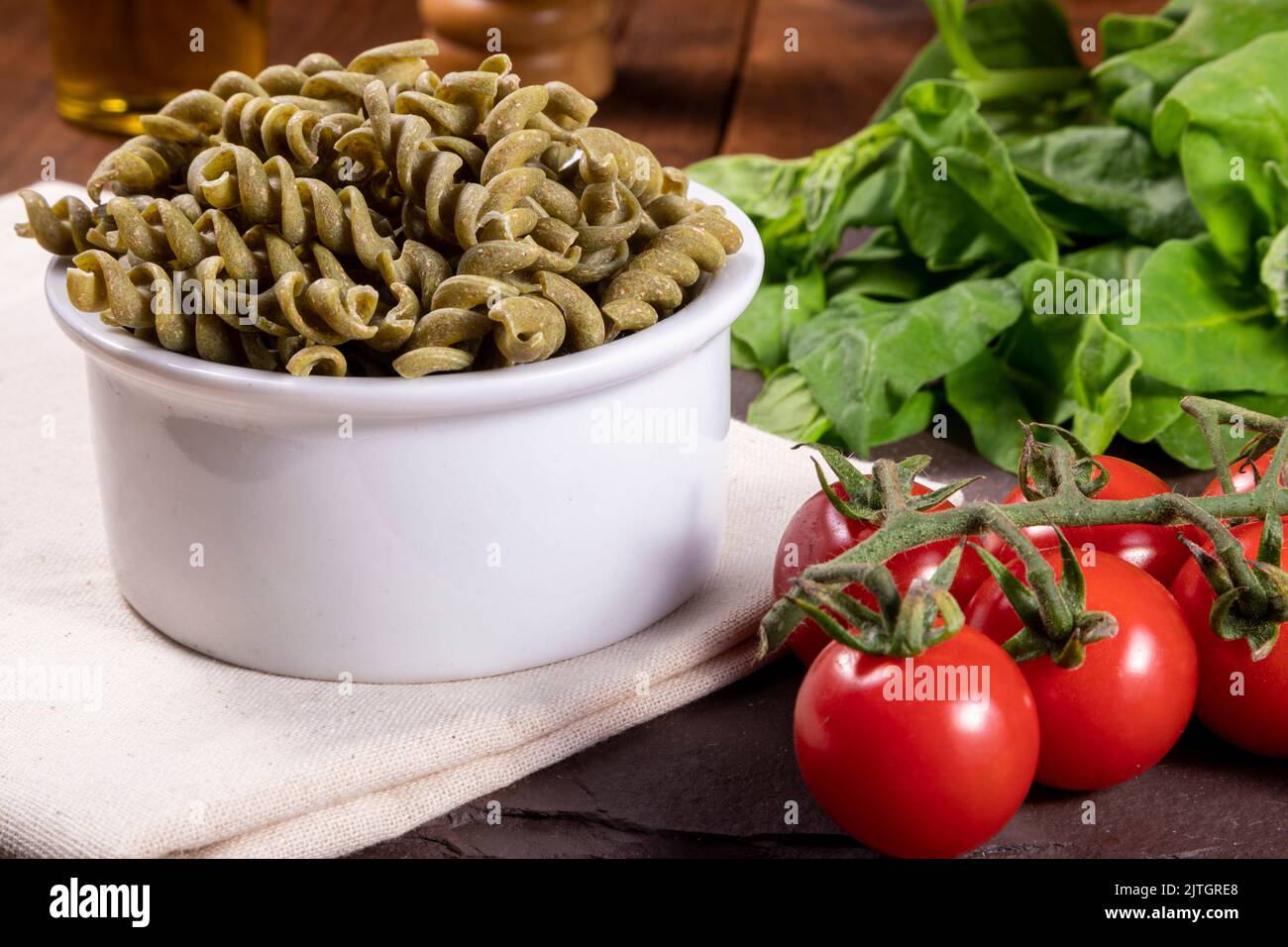 Raw spinach screw noodles, vegetarian, vegan . Healthy food Stock Photo ...