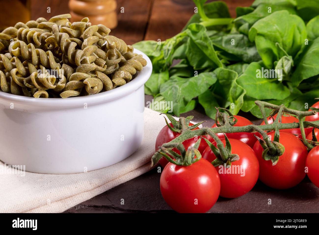 Raw spinach screw noodles, vegetarian, vegan . Healthy food Stock Photo ...