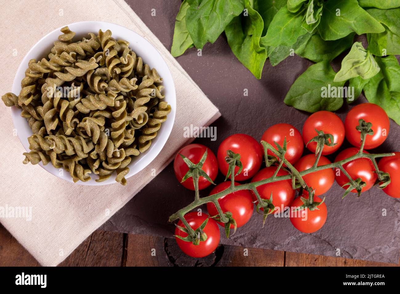 Raw spinach screw noodles, vegetarian, vegan . Healthy food Stock Photo ...