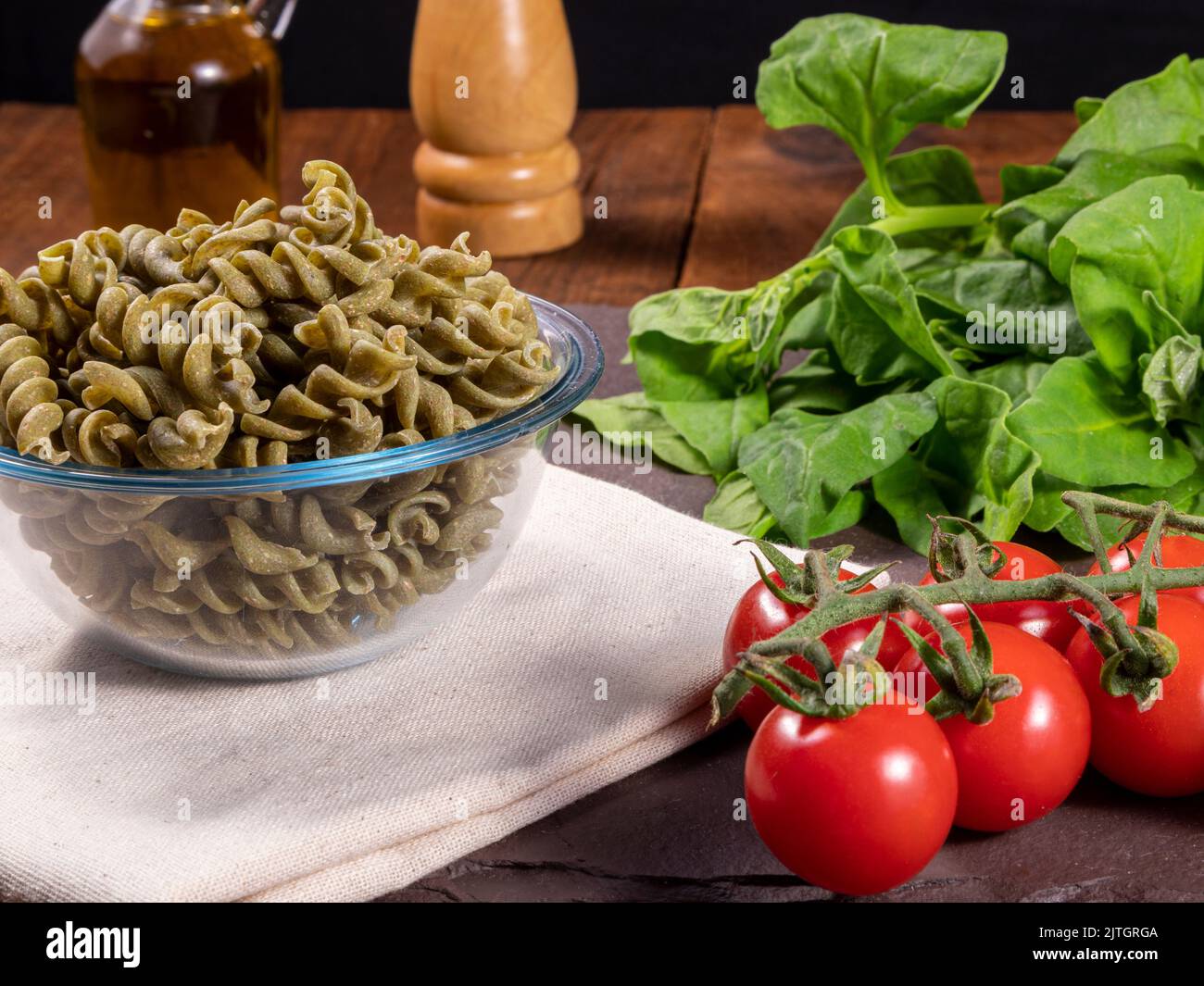 Raw spinach screw noodles, vegetarian, vegan . Healthy food Stock Photo ...
