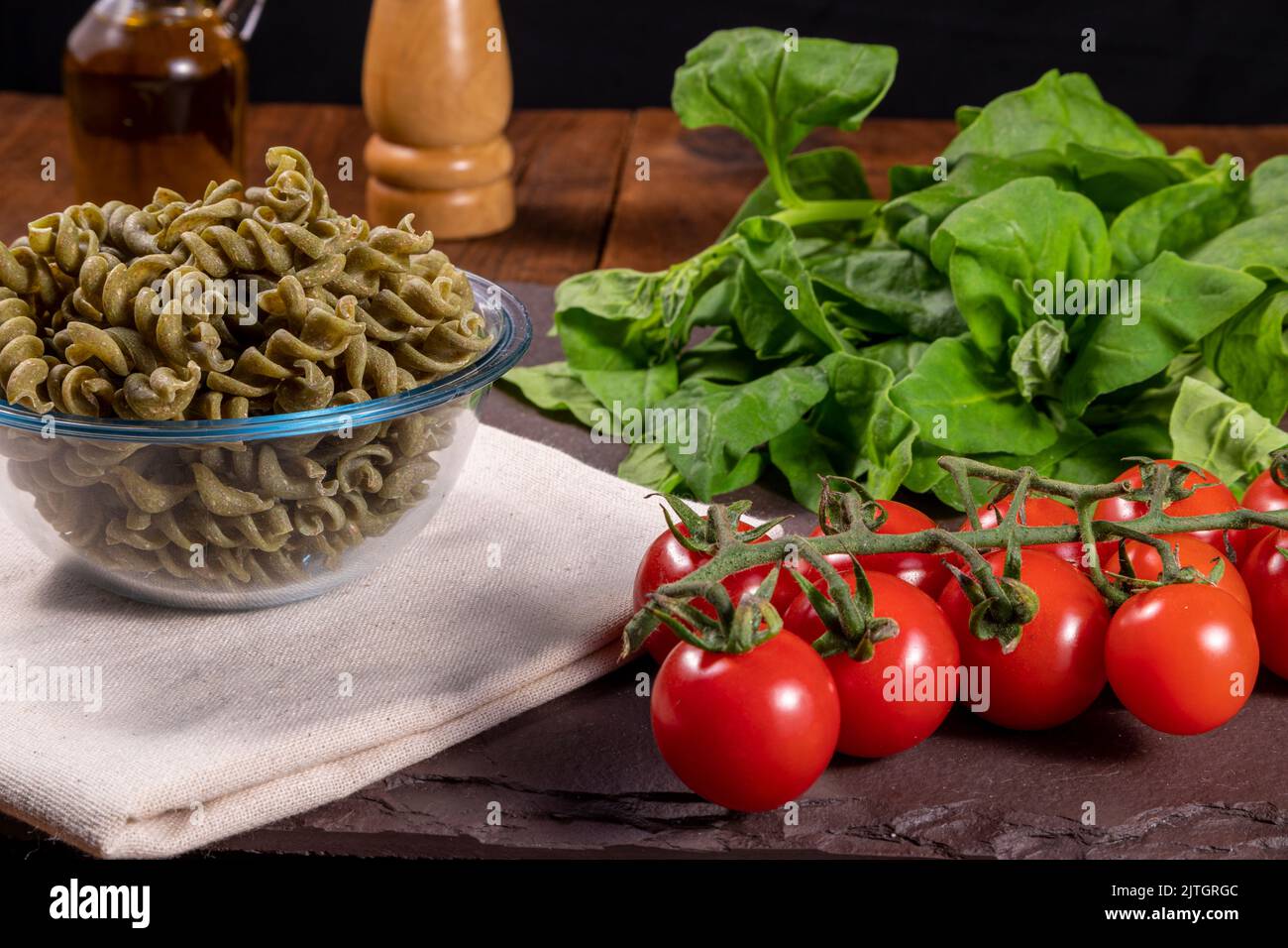 Raw spinach screw noodles, vegetarian, vegan . Healthy food Stock Photo ...