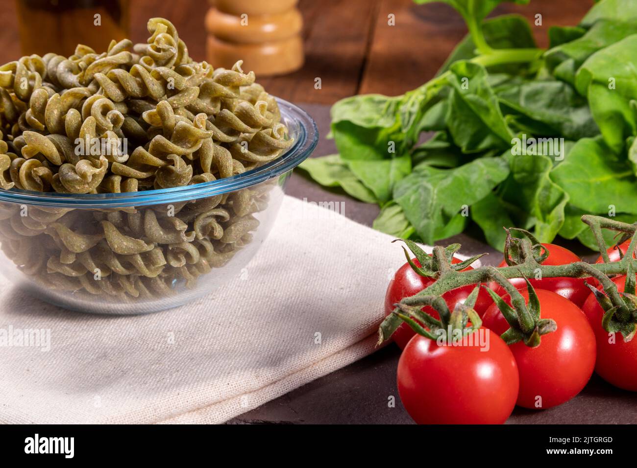 Raw spinach screw noodles, vegetarian, vegan . Healthy food Stock Photo ...