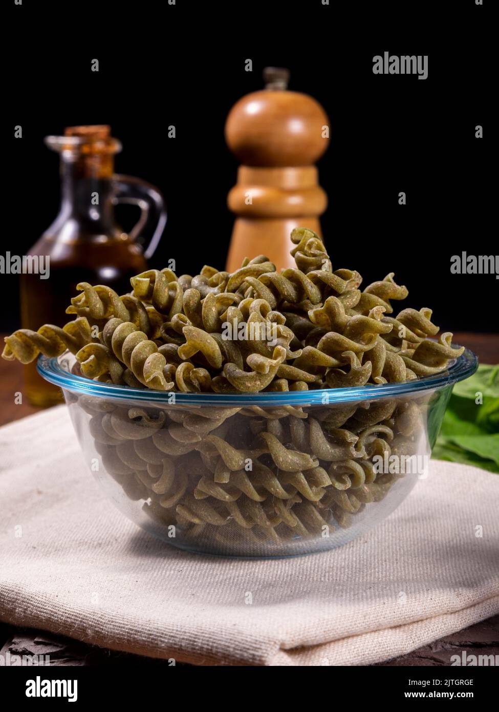 Raw spinach screw noodles, vegetarian, vegan . Healthy food Stock Photo ...