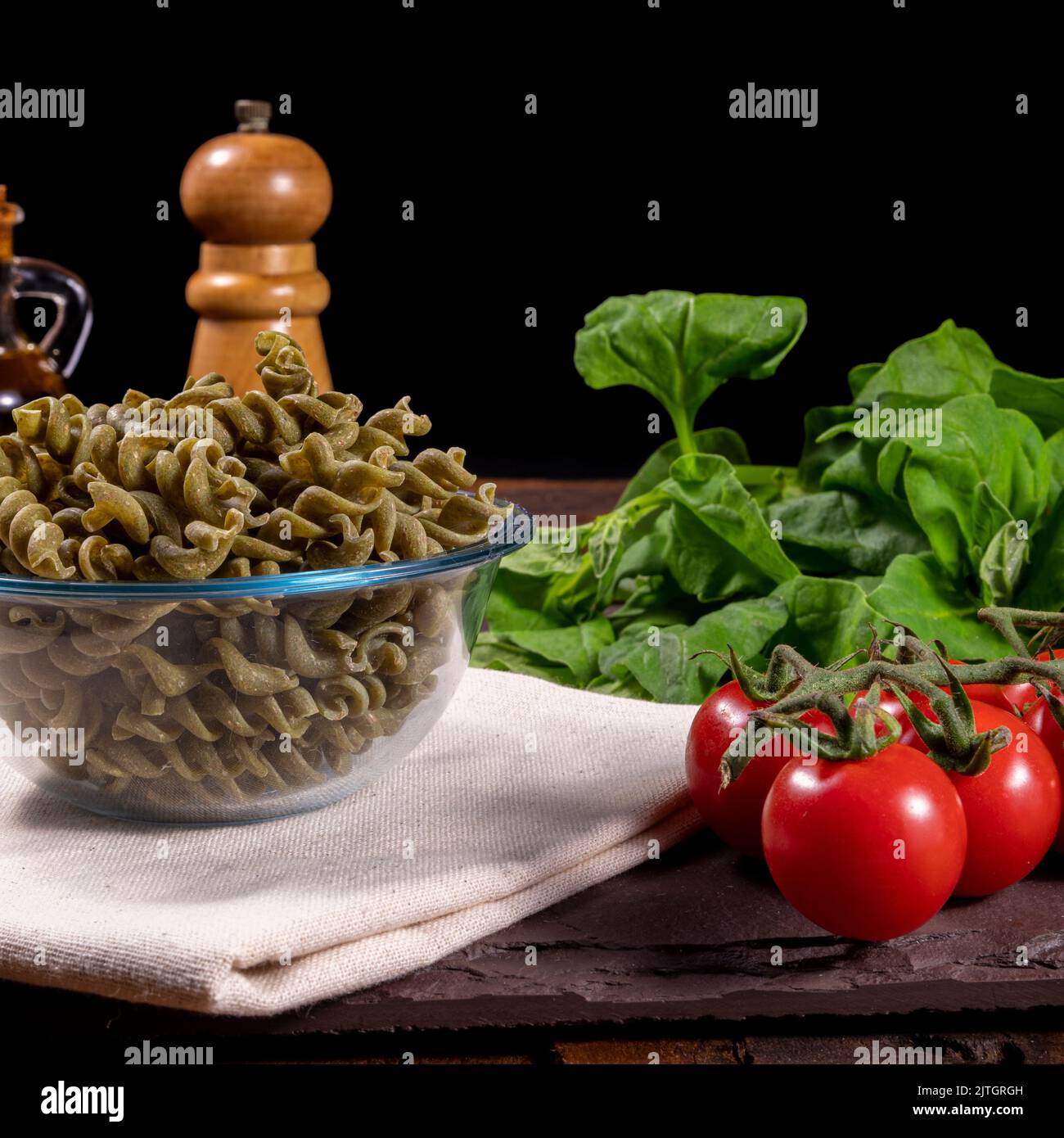 Raw spinach screw noodles, vegetarian, vegan . Healthy food Stock Photo ...