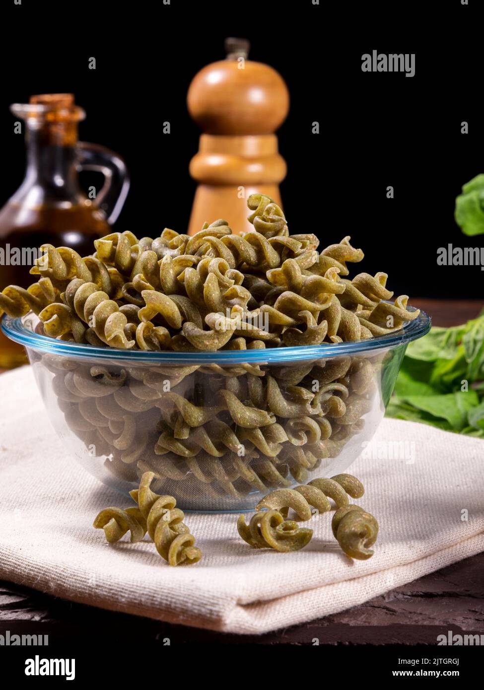 Raw spinach screw noodles, vegetarian, vegan . Healthy food Stock Photo ...