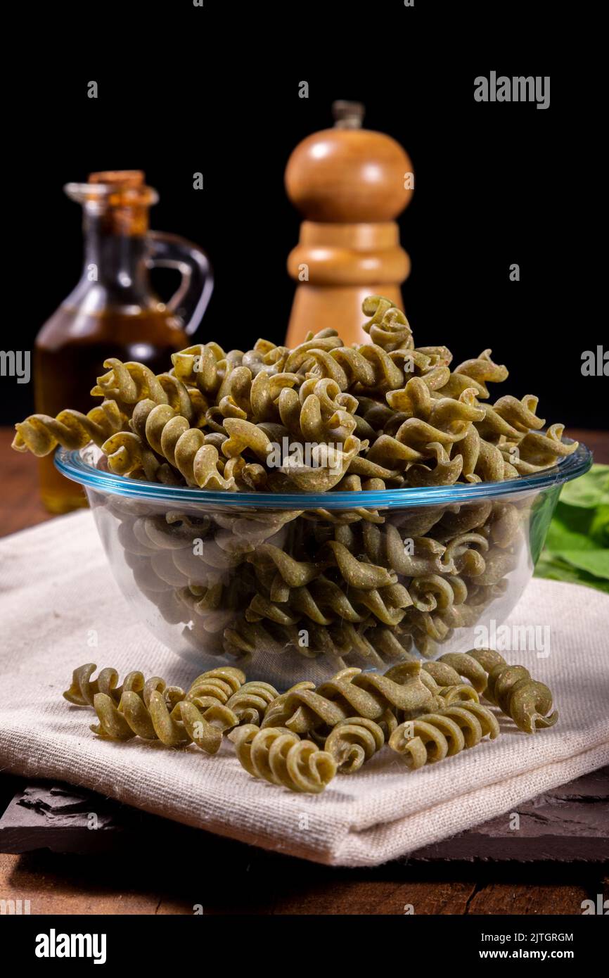 Raw spinach screw noodles, vegetarian, vegan . Healthy food Stock Photo ...