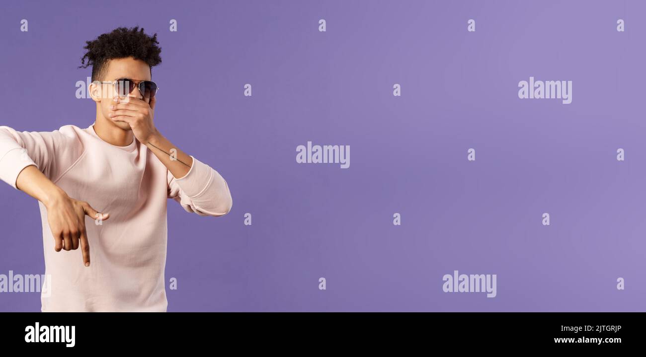 Waist-up portrait of cool young handsome guy with dreads, sunglasses on ...