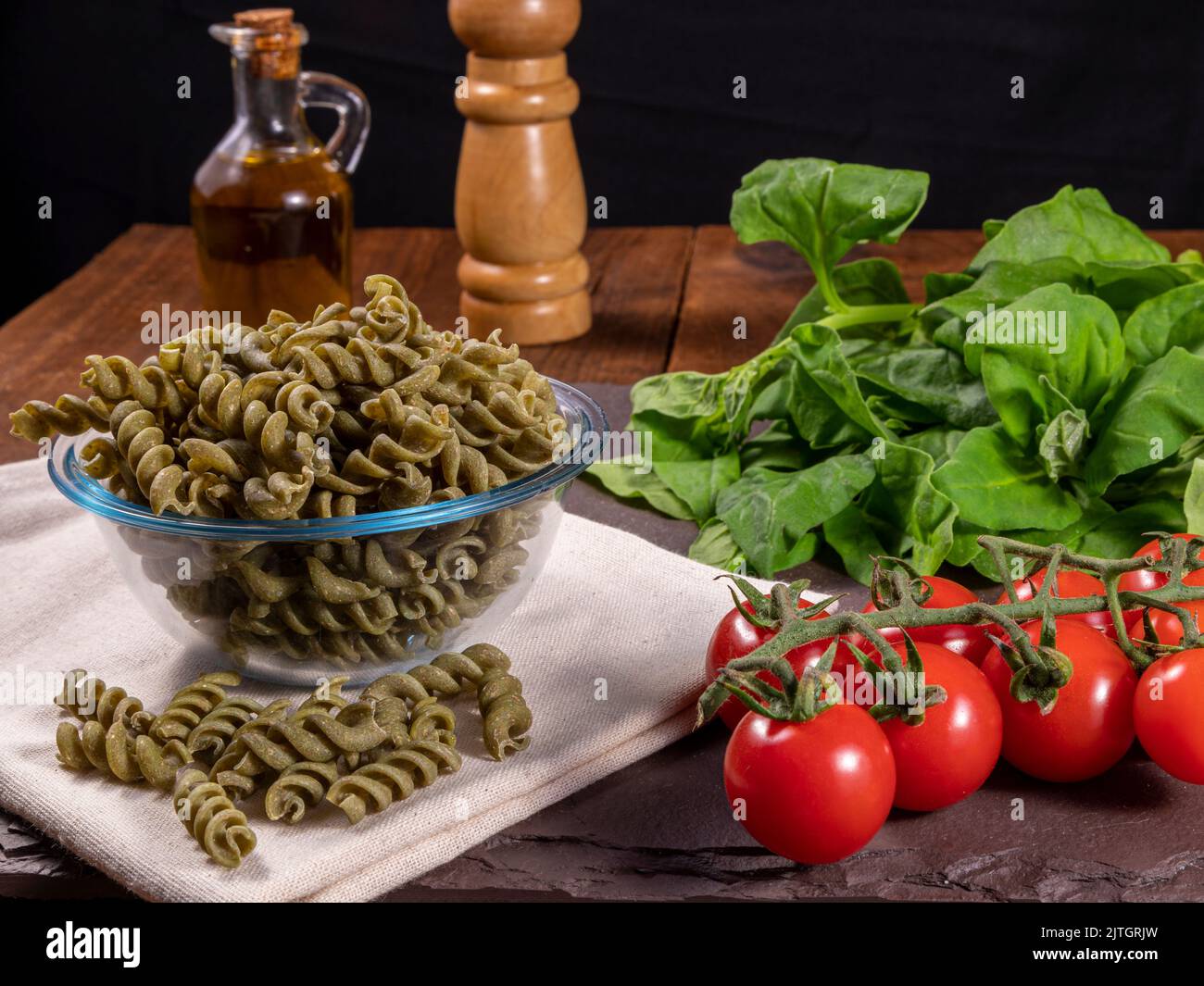 Raw spinach screw noodles, vegetarian, vegan . Healthy food Stock Photo ...