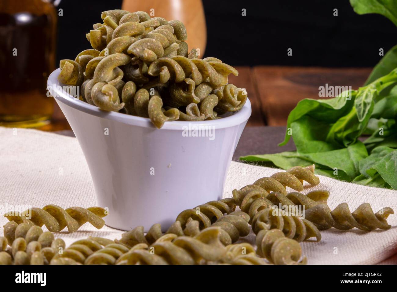 Raw spinach screw noodles, vegetarian, vegan . Healthy food Stock Photo ...
