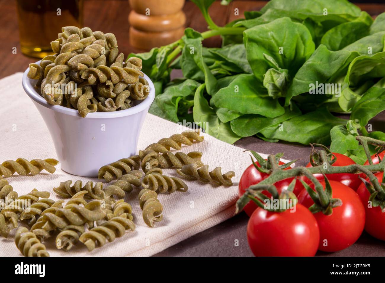 Raw spinach screw noodles, vegetarian, vegan . Healthy food Stock Photo ...