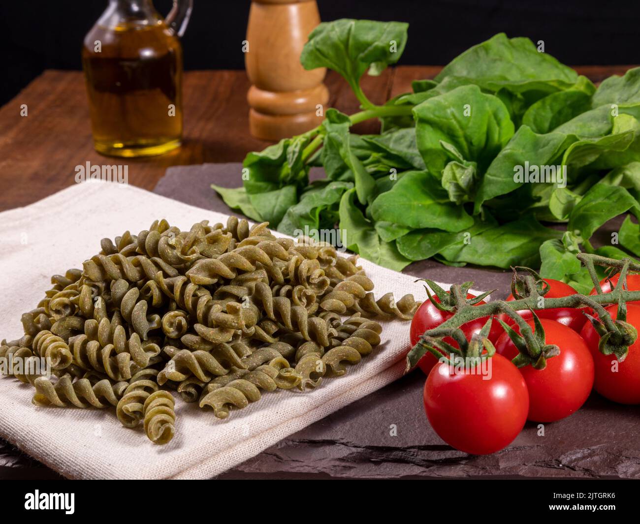 Raw spinach screw noodles, vegetarian, vegan . Healthy food Stock Photo ...