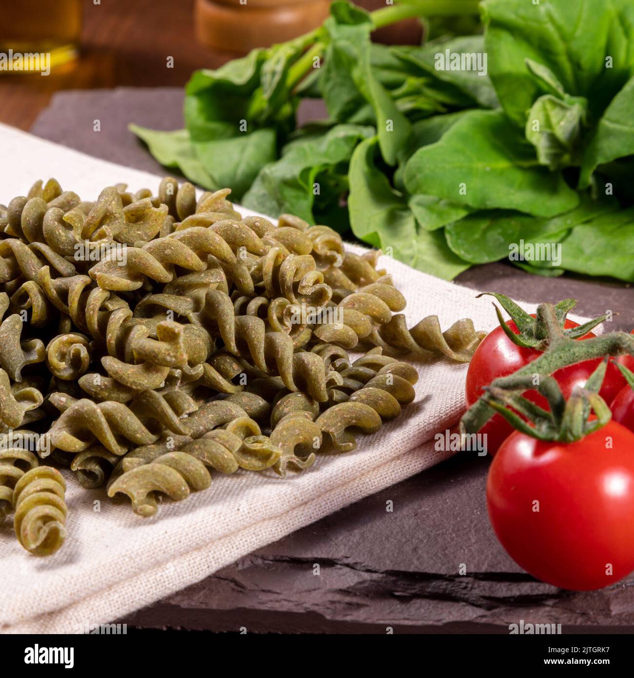 Raw spinach screw noodles, vegetarian, vegan . Healthy food Stock Photo ...