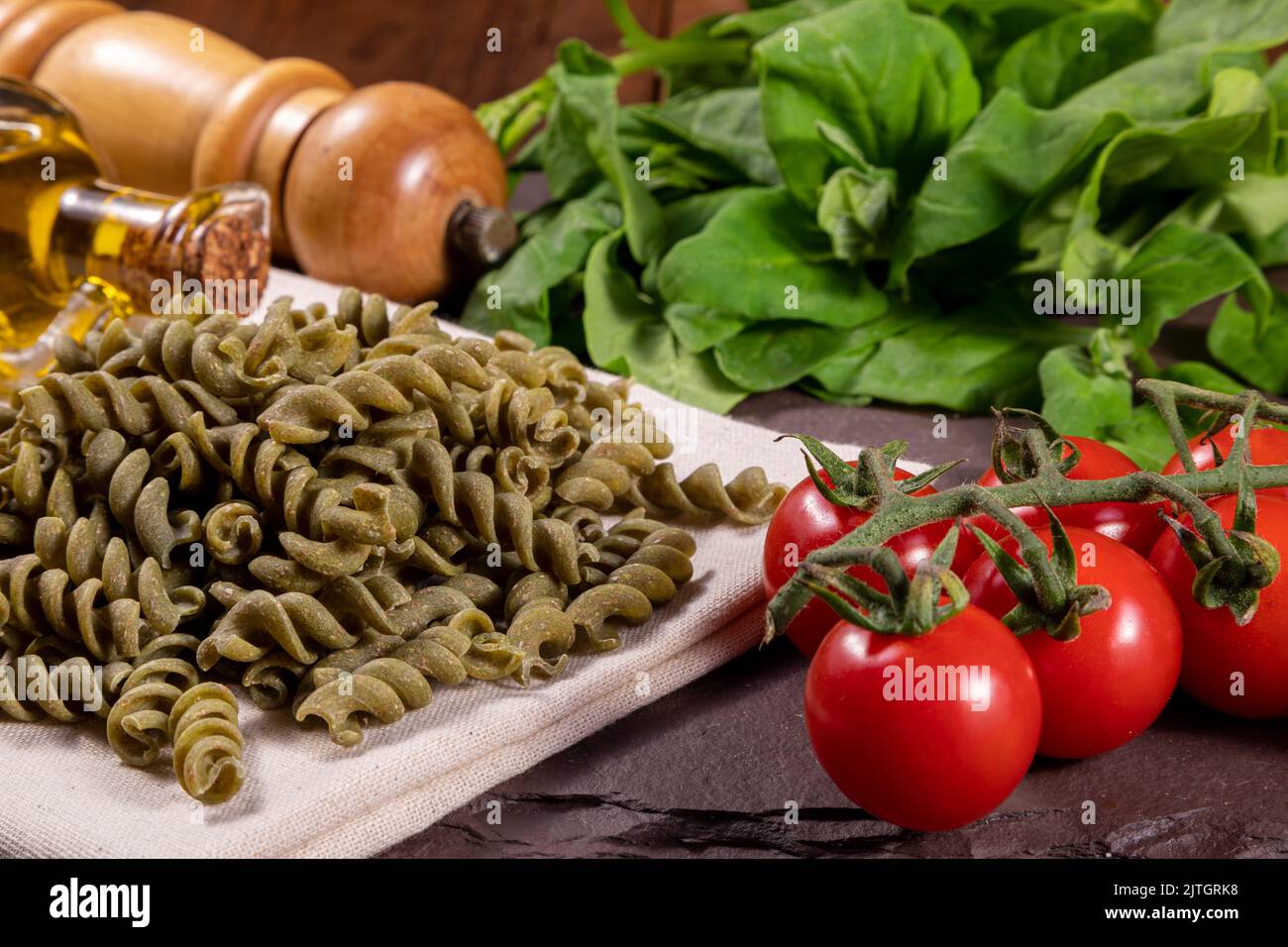 Raw spinach screw noodles, vegetarian, vegan . Healthy food Stock Photo ...