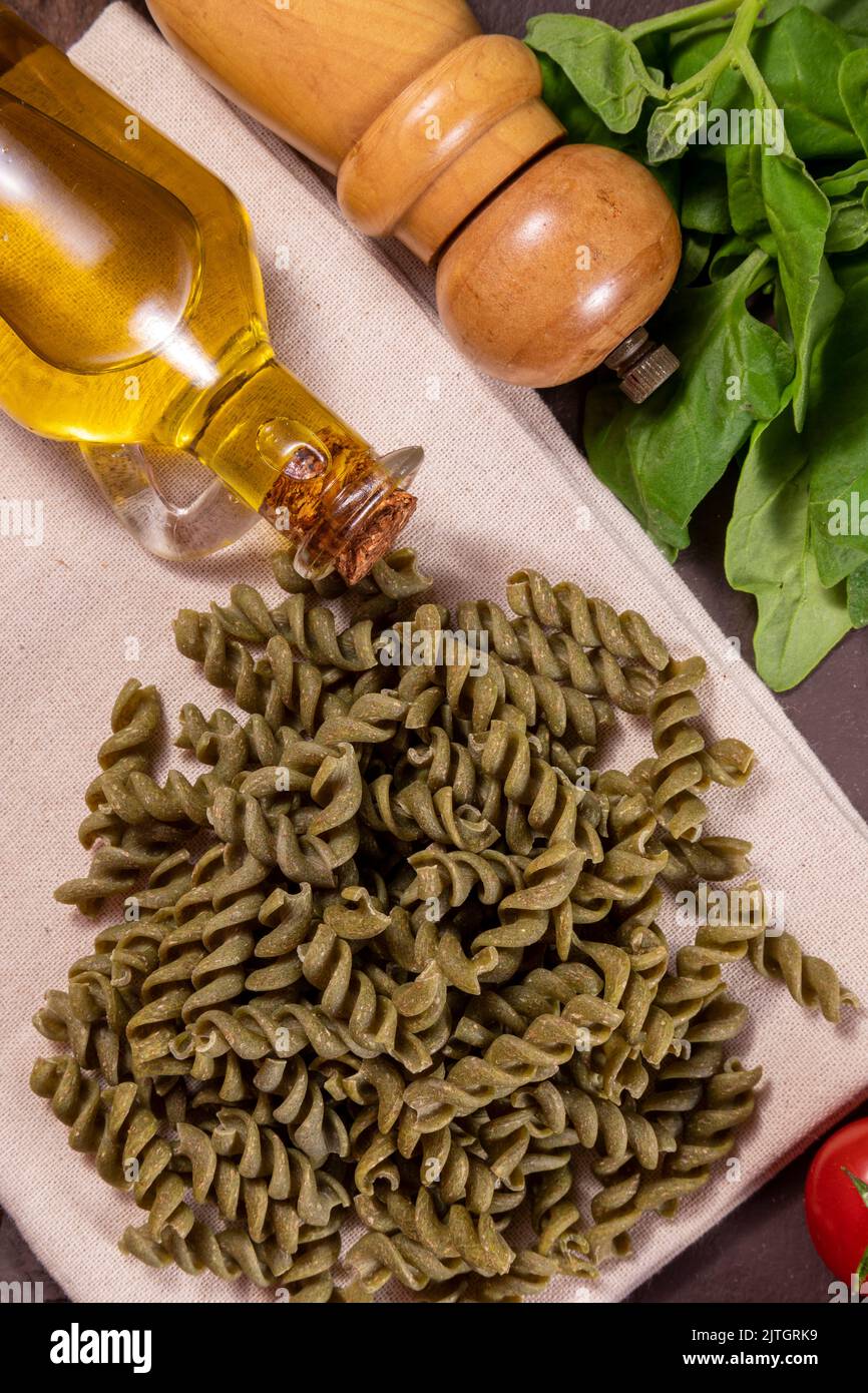 Raw spinach screw noodles, vegetarian, vegan . Healthy food Stock Photo ...