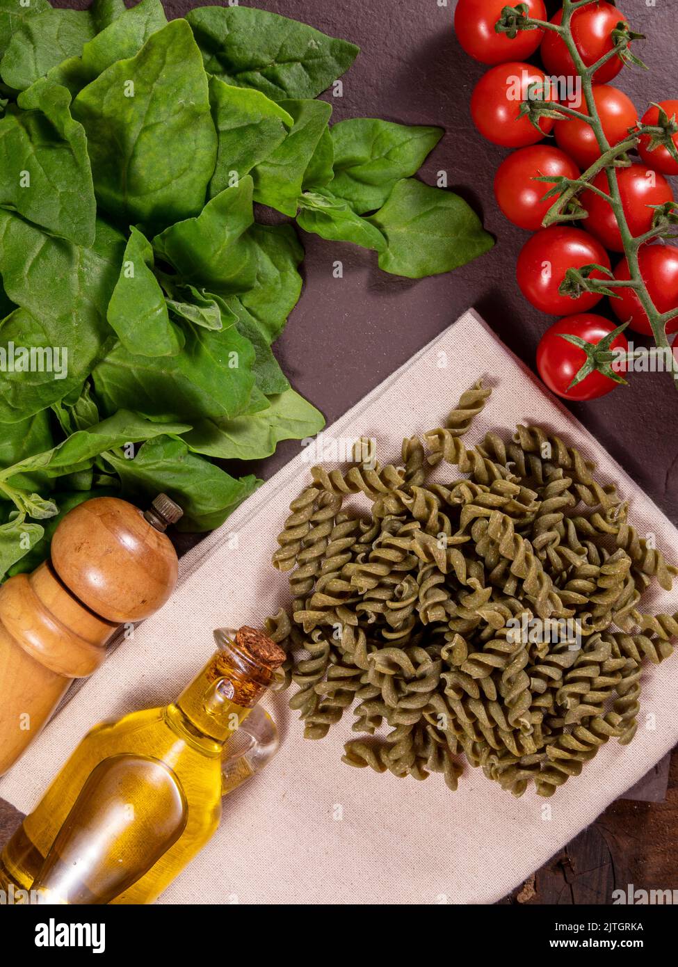 Raw spinach screw noodles, vegetarian, vegan . Healthy food Stock Photo ...