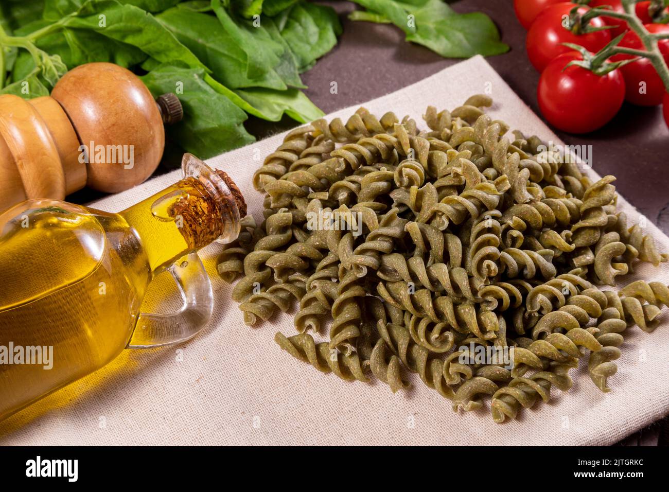 Raw spinach screw noodles, vegetarian, vegan . Healthy food Stock Photo ...