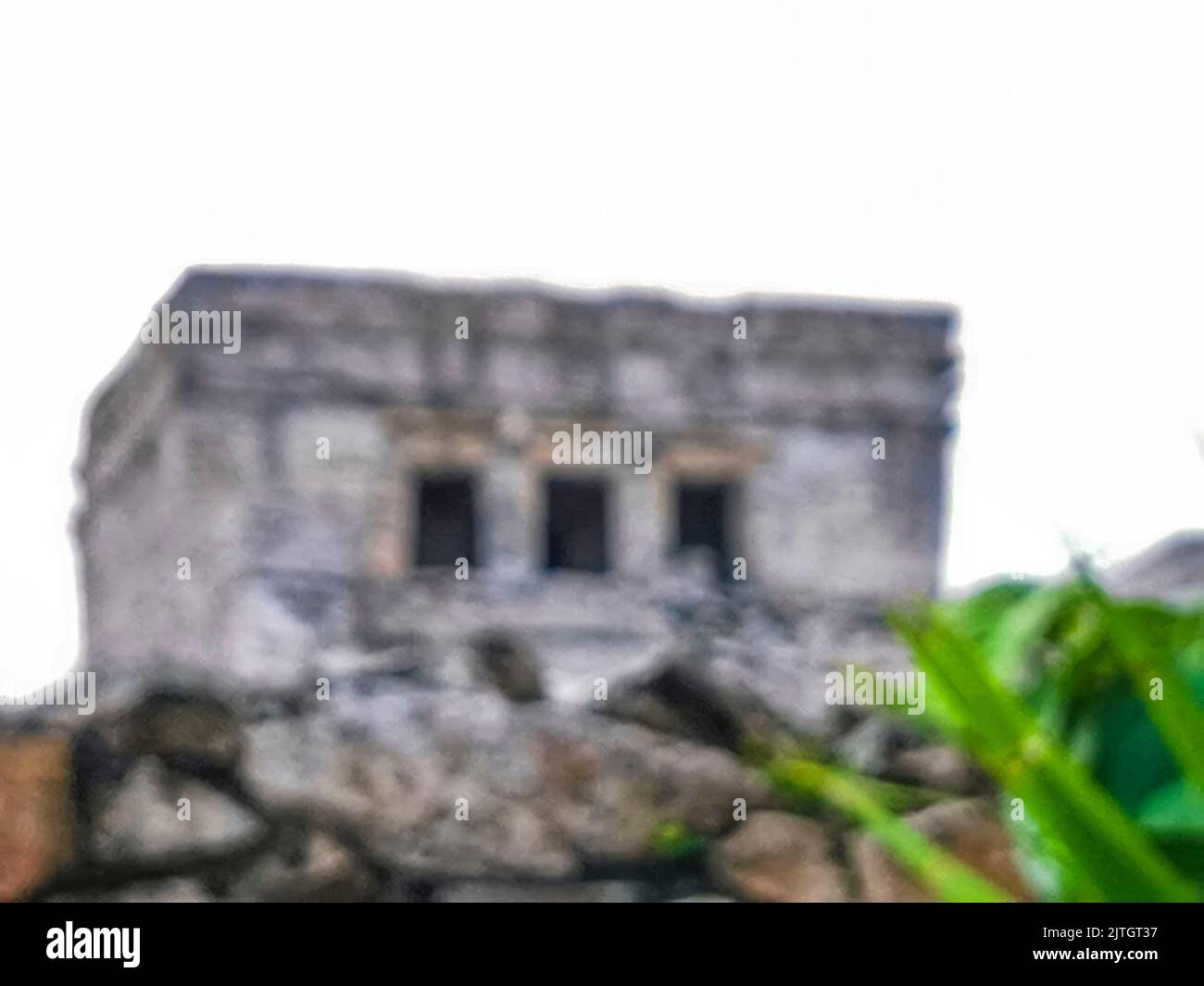 Ancient Tulum ruins Mayan site with temple ruins pyramids and artifacts in the tropical natural ...