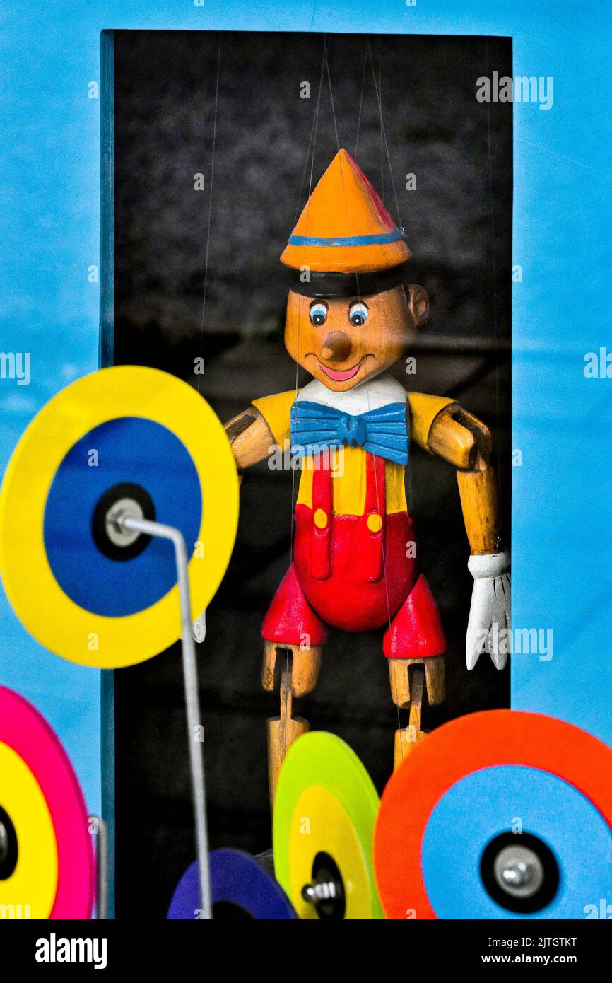 articulated wooden Pinocchio puppet toy in window display Stock Photo ...